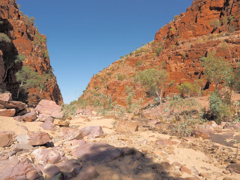 Dry Ormiston Gorge with Red Glowing Cliffs in the Evening Sun Stock ...