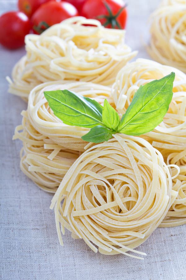 Dry pasta with fresh basil stock image. Image of freshness - 49479507
