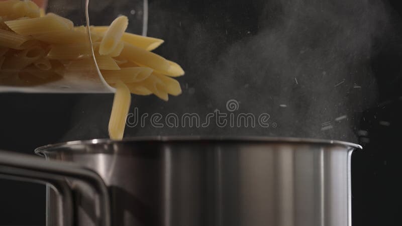 Dry Penne Falling into Saucepan Stock Photo - Image of water, boiled ...