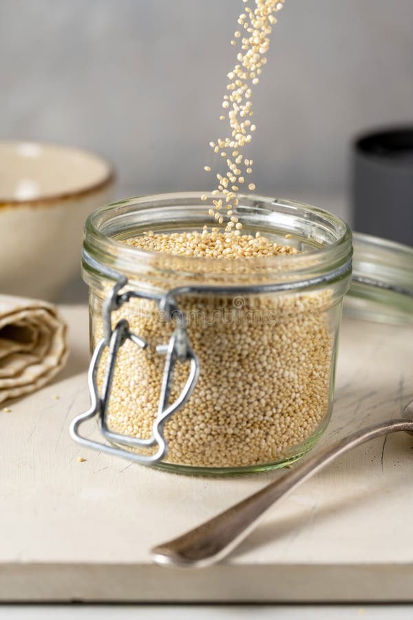 Dry Quinoa Uncooked in a Glass Jar. Healthy Eating Stock Image - Image ...