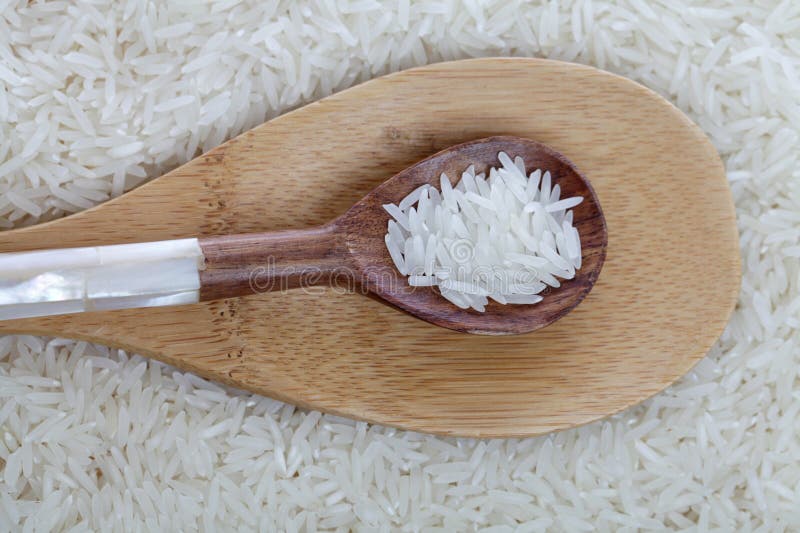 Dry Raw Long Grain Rice on Wooden Spoon, Top View Stock Photo - Image ...