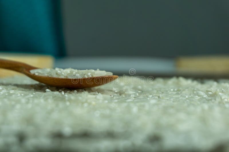 Dry Rice or Uncooked Rice. Top Angle View of Raw Rice and Wooden Spoon ...