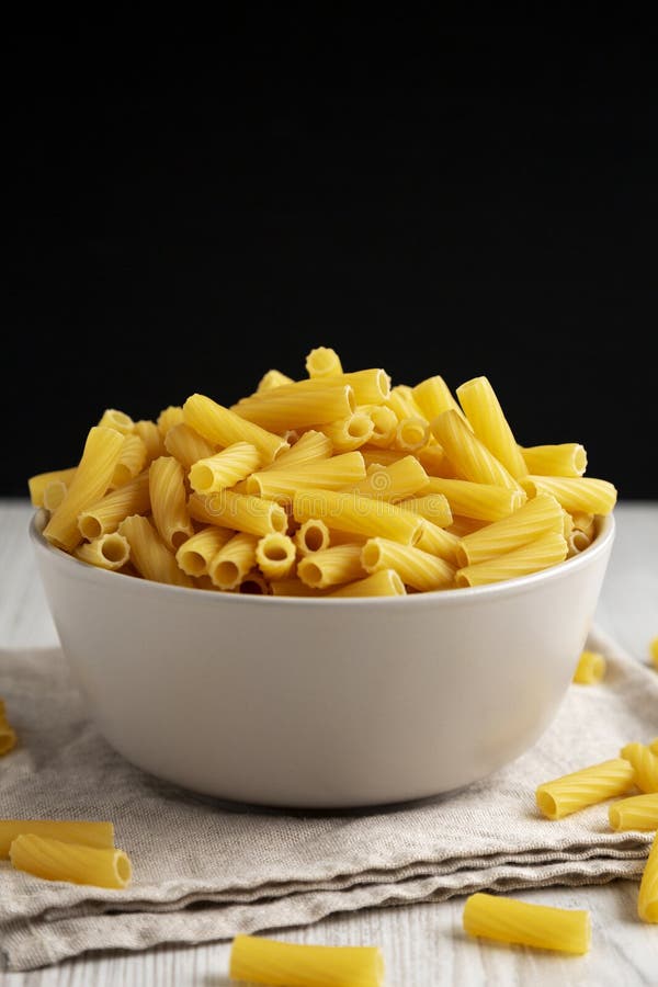 Dry Rigatoni Pasta in a Bowl, Side View Stock Photo - Image of ...