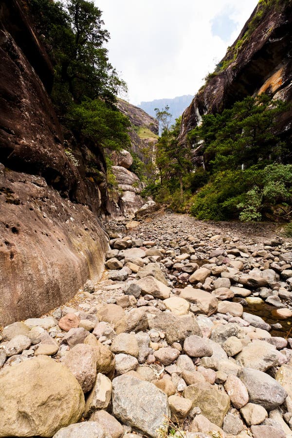 Dry Riverbed with Mountains in the Background Stock Photo - Image of ...