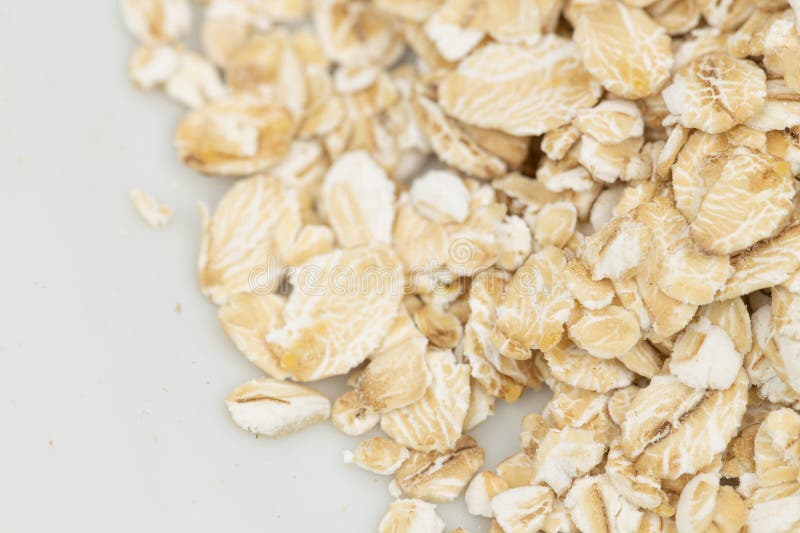 Dry Rolled Oatmeal in Bowl Isolated on White Background. Top View Stock ...