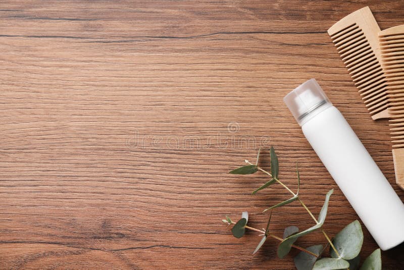 Dry Shampoo Spray and Combs on Wooden Table in Bathroom Stock Photo ...
