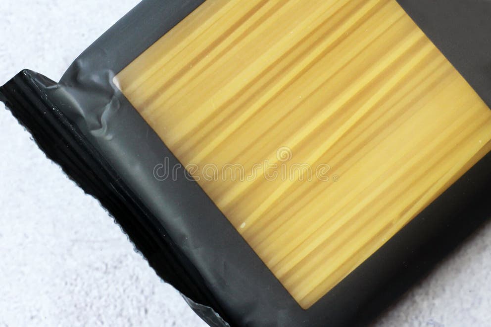 Dry spaghetti in a package stock photo. Image of food - 218435176