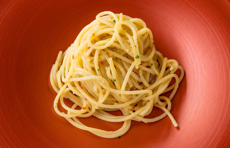 Dry spaghetti in red plate stock image. Image of noodles - 150025211