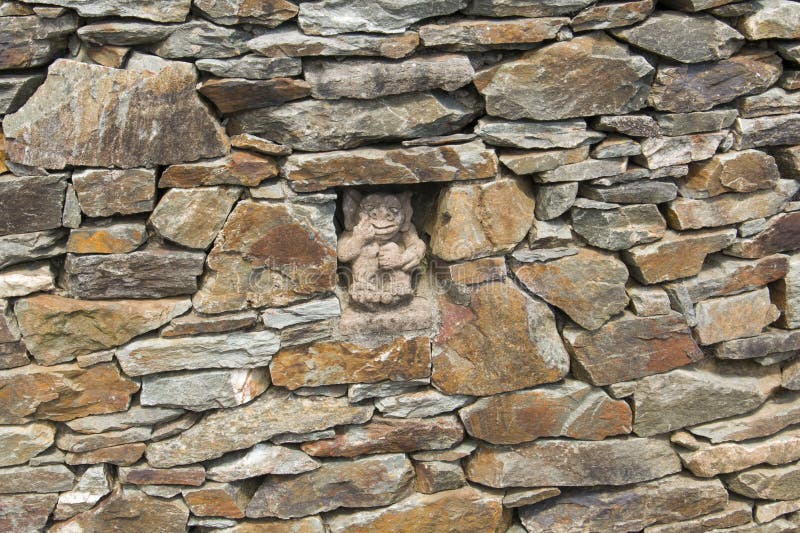 Dry Stone Wall with a Gargoyle Built in. Stock Photo - Image of ...