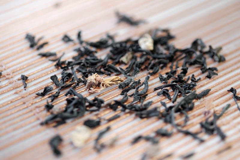 Dry Tea Leaves Spread on Light Brown Color Background Stock Image ...