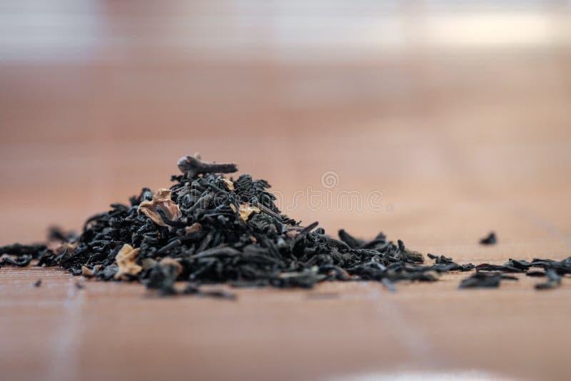 Dry Tea Leaves Spread on Light Brown Color Background Stock Photo ...