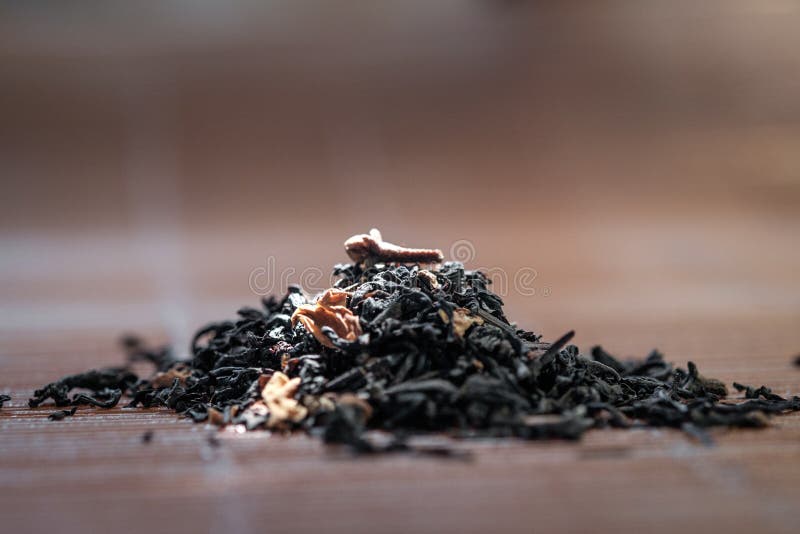 Dry Tea Leaves Spread on Light Brown Color Background Stock Image ...
