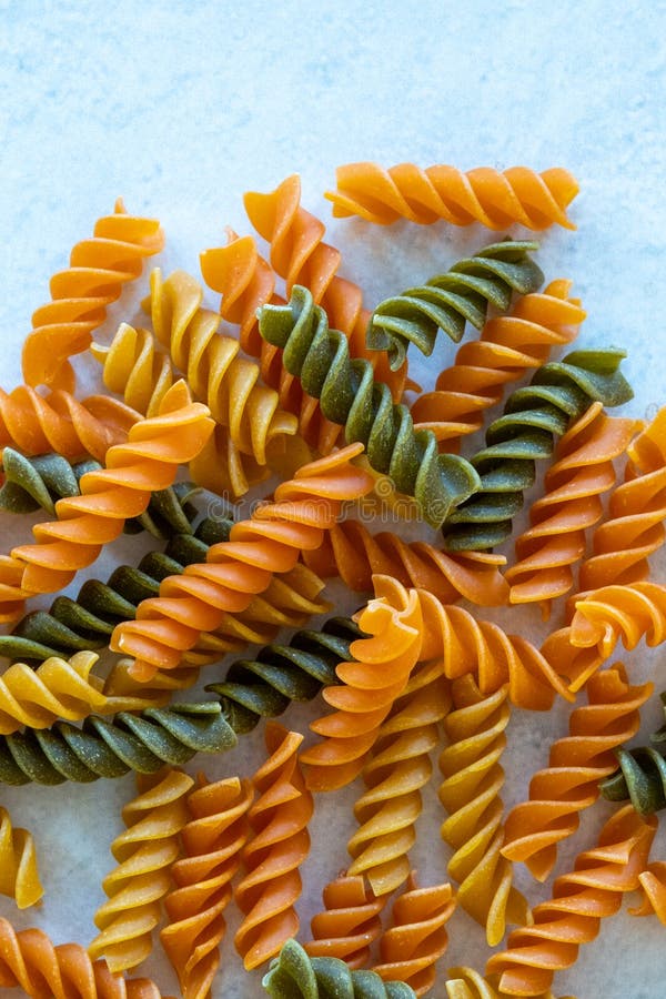 Dry Tricolor Fusilli Pasta on White Granite Background Stock Photo ...