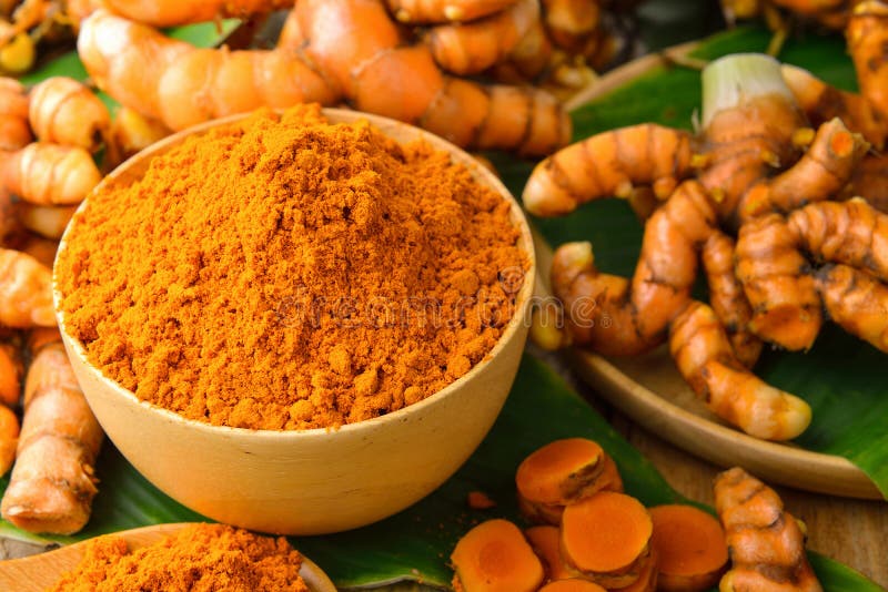Dry Turmeric in a Wood Bowl with Leaf and Fresh Turmeric Stock Image ...