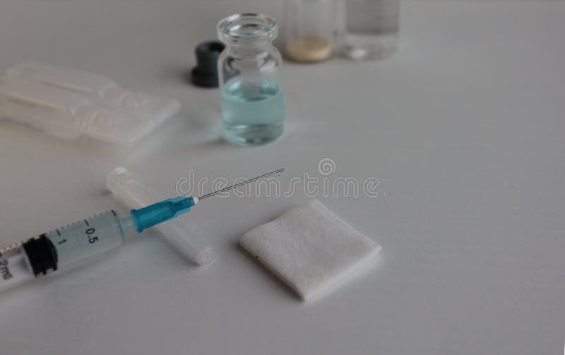 The Dry Vaccine is in a Vial and a Syringe for Injection. Stock Photo ...