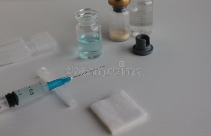 The Dry Vaccine is in a Vial and a Syringe for Injection. Stock Image ...