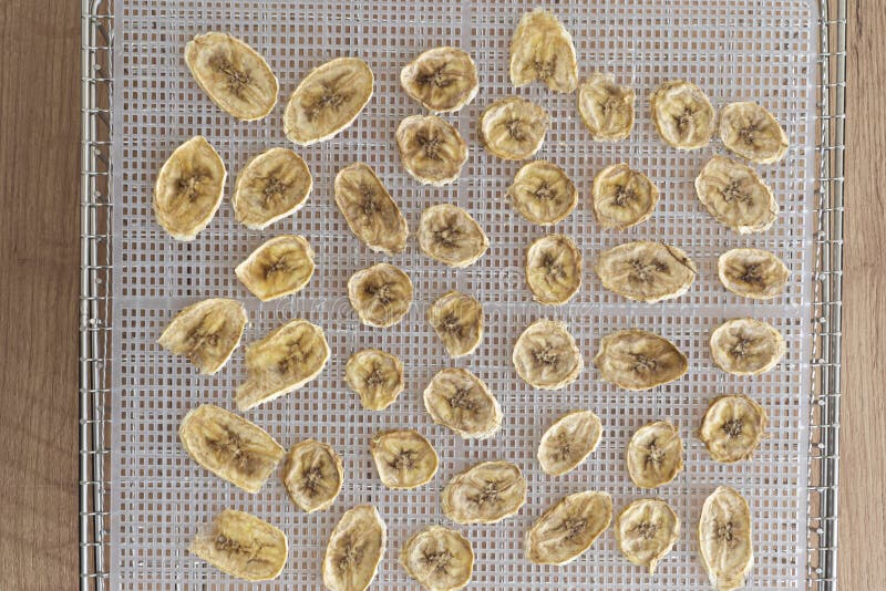 Drying bananas on a grid stock image. Image of sweet - 266430817
