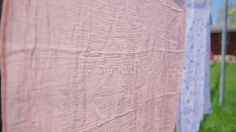 Drying Bed Sheets Outdoor Which Develops in the Wind in Summer Time ...