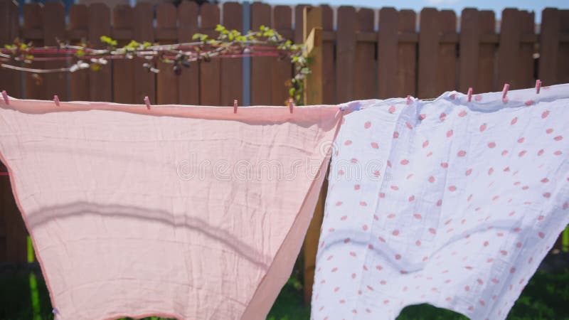 Drying Bed Sheets Outdoor Which Develops in the Wind in Summer Time ...