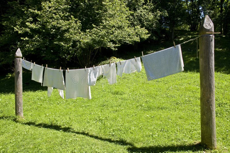 Laundry Drying on Clothesline Stock Photo - Image of clothes, string ...