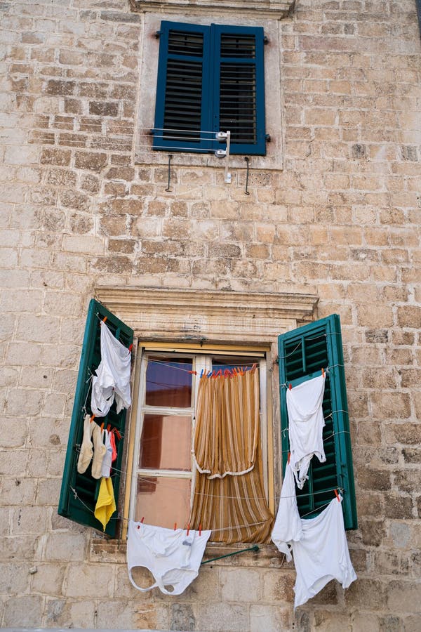 Drying Clothes Outside the Window in Kotor. Stock Image - Image of ...