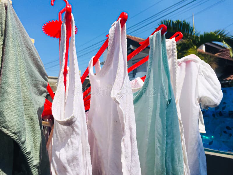 Drying Clothes when the Sun is Hot Stock Photo - Image of clothespin ...