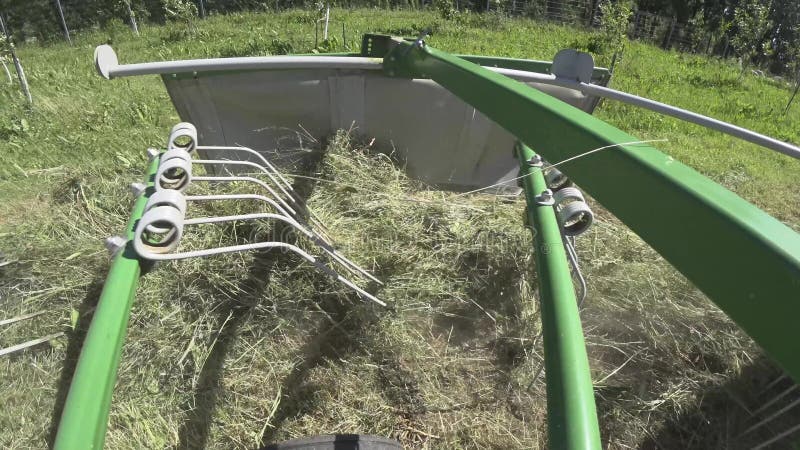 Drying Hay by Turning with a Rotor Tractor Rake Stock Video - Video of ...