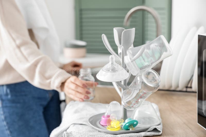 Drying Rack for Baby Bottles on Table in Kitchen Stock Photo - Image of ...