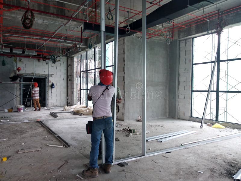 Drywall Installation Work in Progress by Construction Workers at the ...