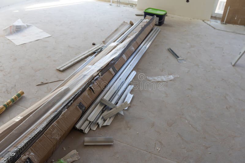 Installation of Drywall. Workers are Using Screws and a Screwdriver To ...