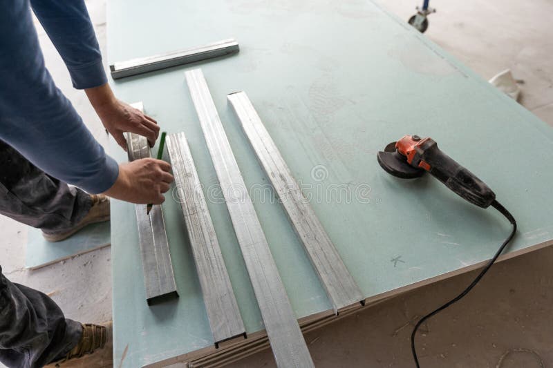 Drywall Installers. Men Holding a Gypsum Board Figured Cut Stock Image ...
