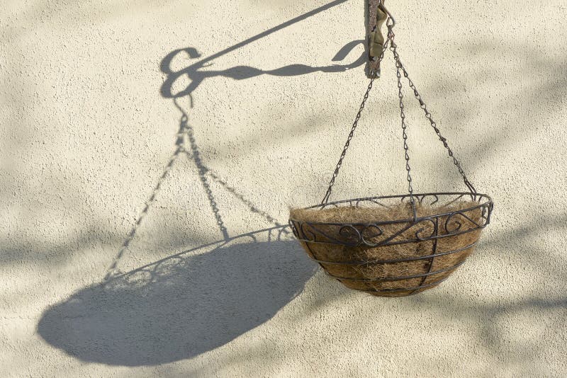 Empty Hanging Swing Nest on the Background of a Snow-covered Rural ...