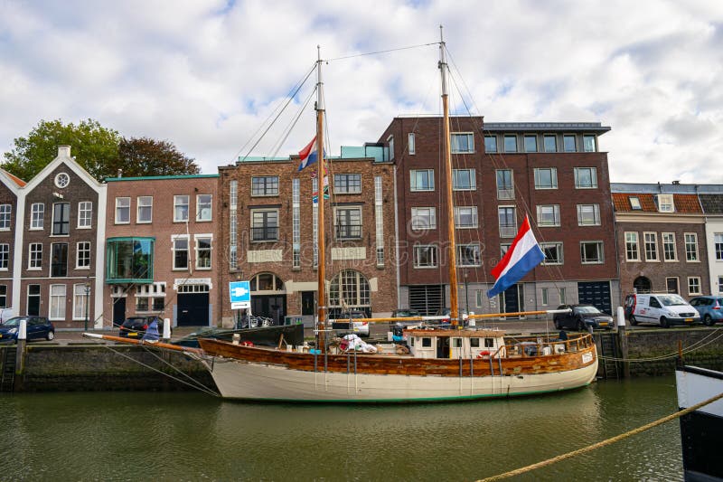 Old Wooden Ship with Dutch Flag at a Quay in Dordrecht, Netherlands ...