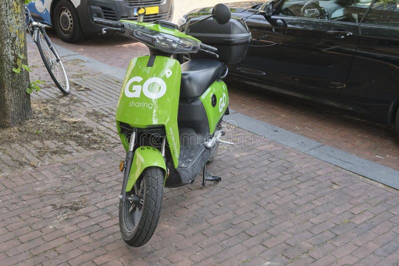 A Green Go Sharing Electrical Scooter in City Editorial Stock Image ...