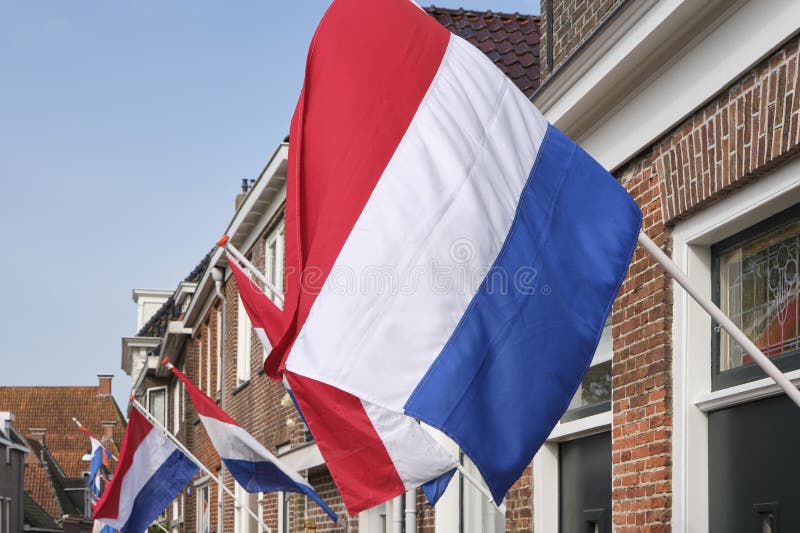 Dutch Flags Waving in a Dutch Street on Koningsdag Stock Image - Image ...