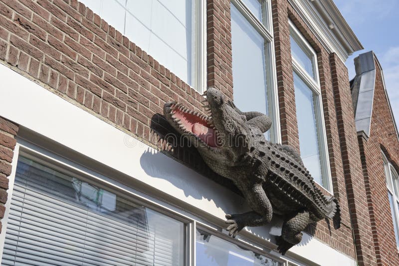 Fake Crocodile or Alligator on the Facade of a House Editorial Stock ...