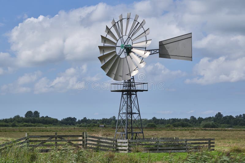 An American Wind Engine Against a Blue Sky Stock Image - Image of ...