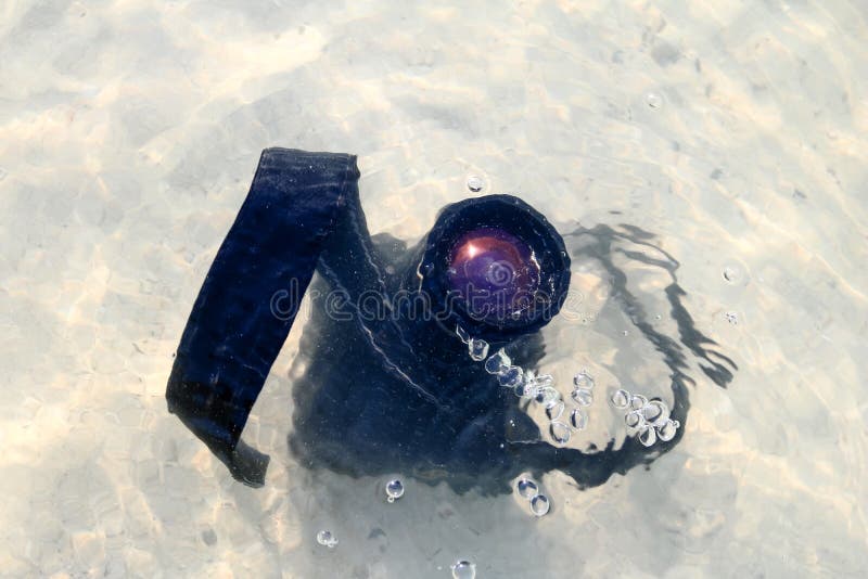 The DSLR Camera Fall To the Sea Water. Stock Photo - Image of color ...