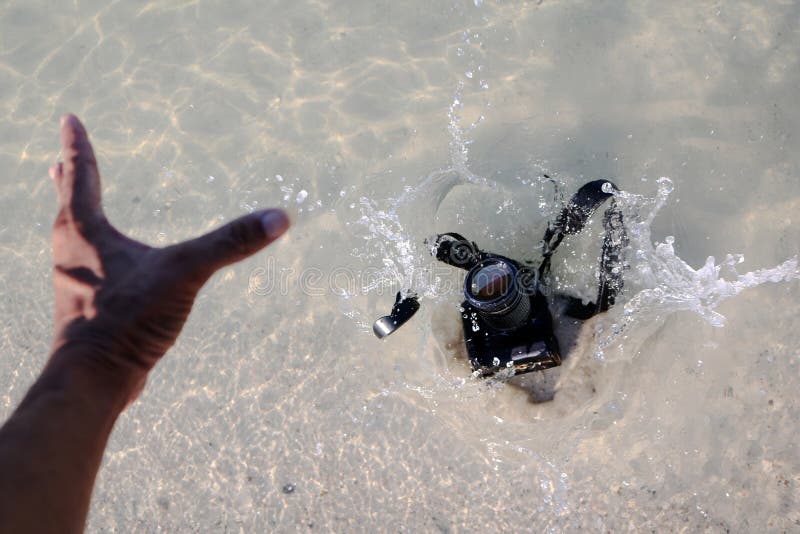 The DSLR Camera Fall To the Sea Water. Stock Photo - Image of design ...