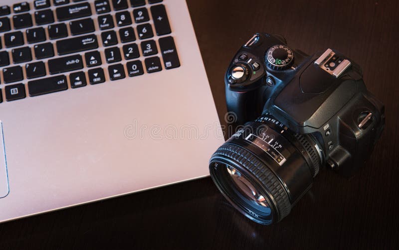 DSLR camera and laptop stock photo. Image of dslr, angle - 64432094