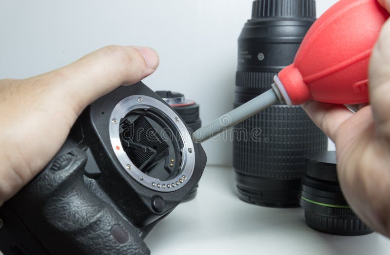 DSLR Camera Lens Cleaning by Blowing Dust of the Image Sensor Stock ...