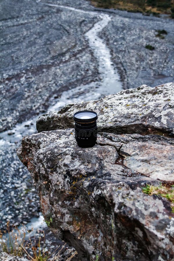 DSLR Camera Lens on the Edge of a Stone Overlooking Stock Photo - Image ...