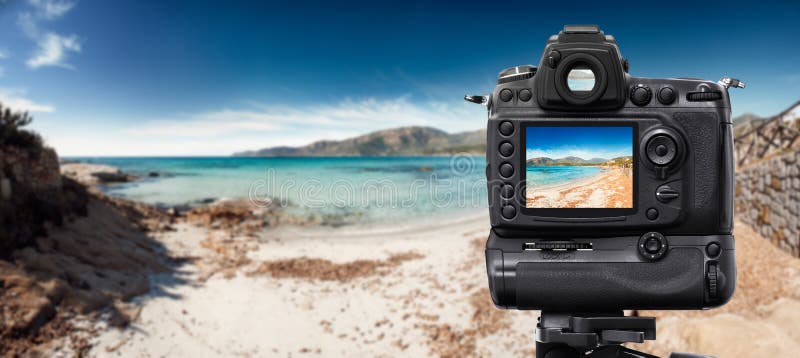 DSLR Camera on Tripod Shooting in the Beach. Stock Image - Image of ...
