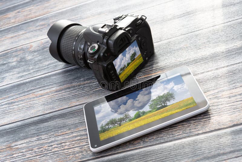DSLR and tablet. stock image. Image of device, photographer - 55677557