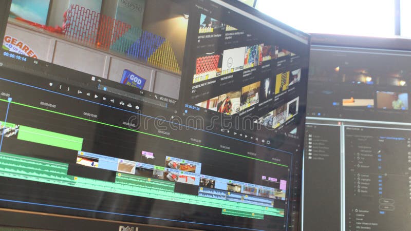 Dual Monitor Editing Session with Light from Window Editorial ...