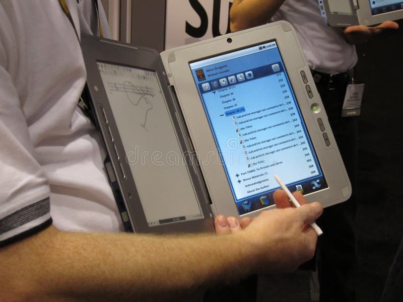 Dualbook ebook reader editorial photography. Image of reader - 12530232