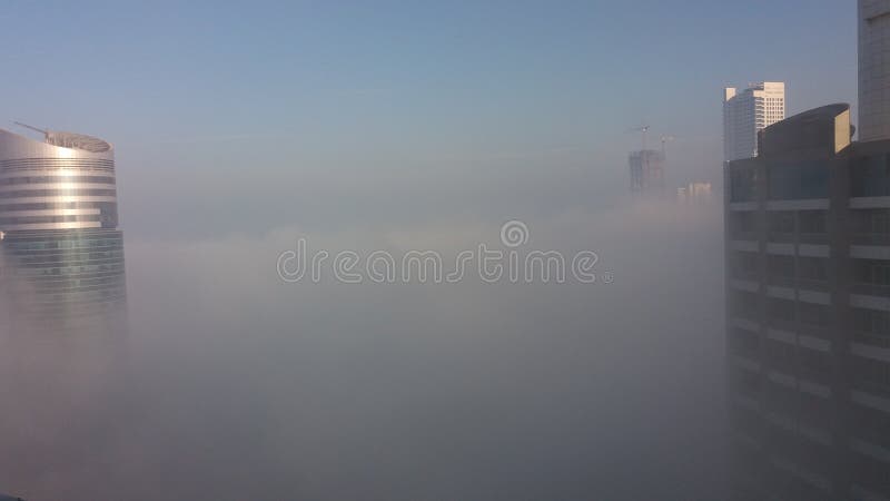 Dubai building view in fog stock image. Image of hotel - 166921635