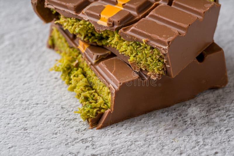 Dubai Chocolate Bar with Green Kadayif and Peanut Butter on White Stone ...