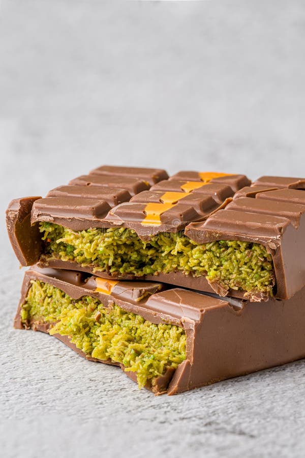 Dubai Chocolate Bar with Green Kadayif and Peanut Butter on White Stone ...