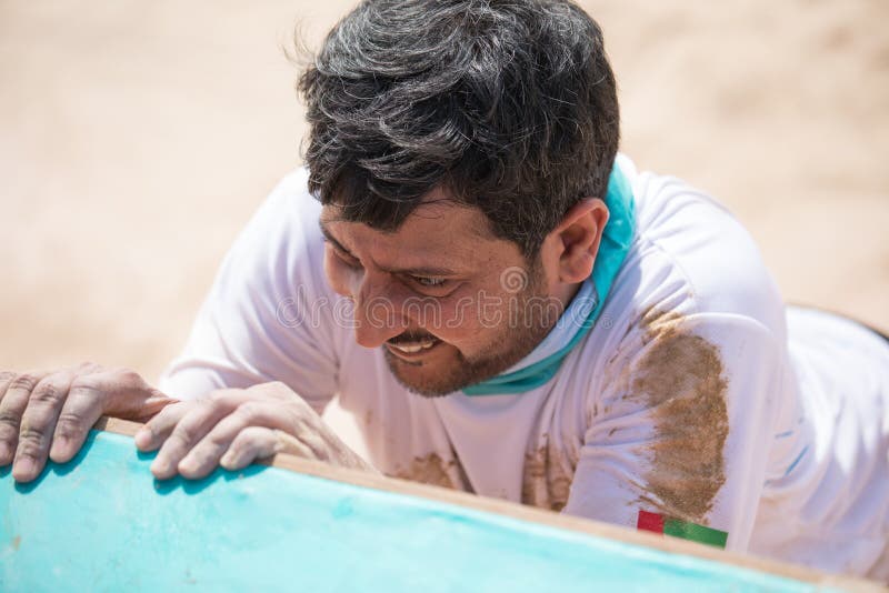 Dubai, UAE - Feb 10, 2017: Participant Competing on an Obstacle Course ...